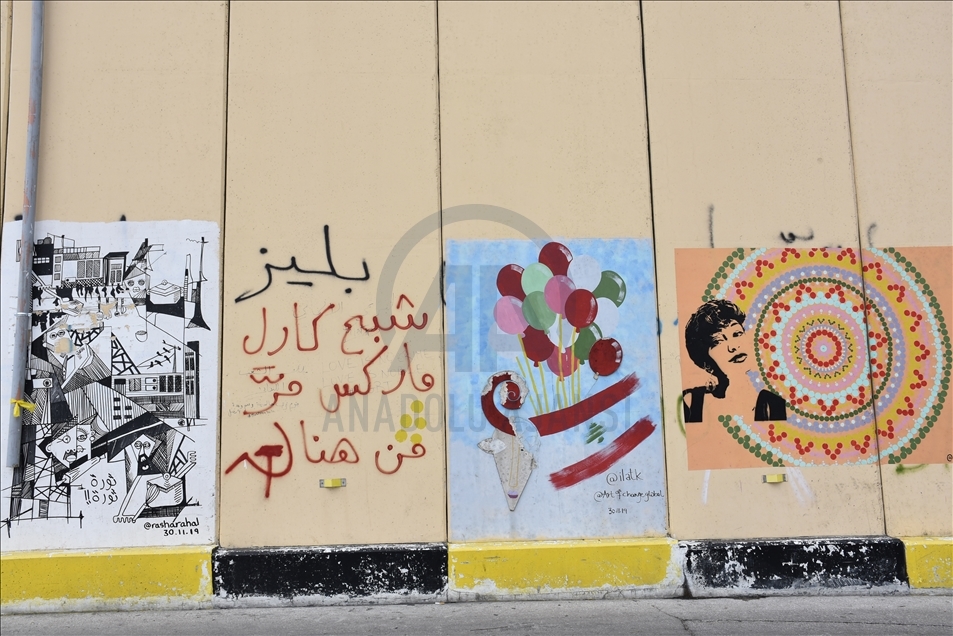Protesters draw attention to Lebanon's problems with graffiti drawings ...