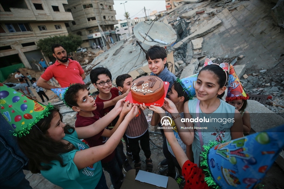 Palestinian child's birthday celebrated near debris of former house ...