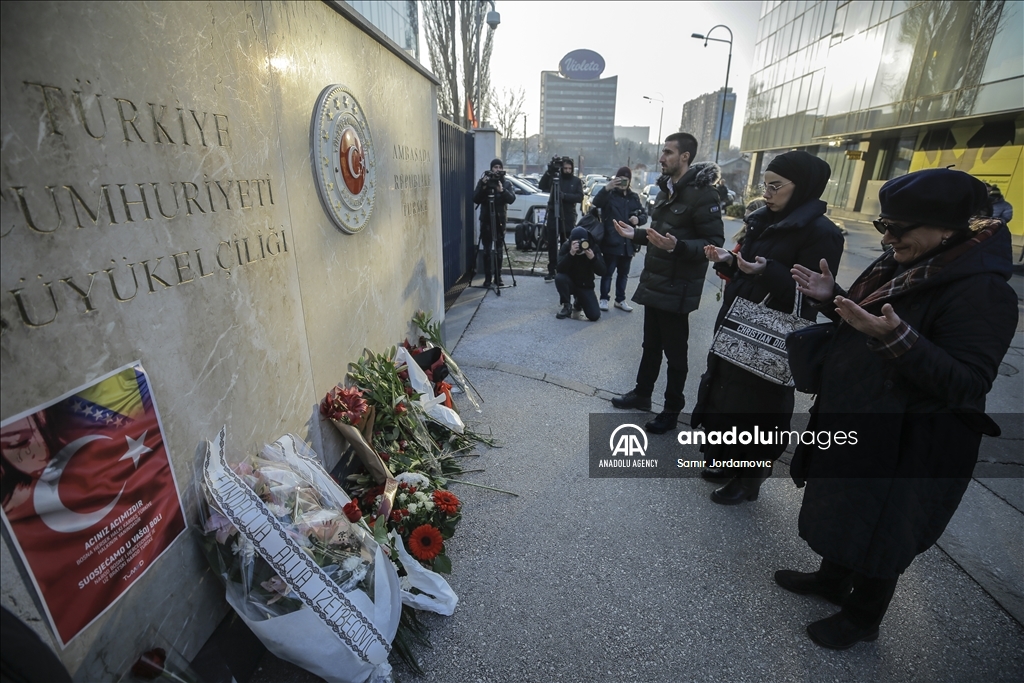 People lay flowers at the Turkish Embassy in Sarajevo, capital of ...