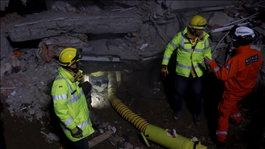 Rescue workers from the UK assisting with search operations in ...